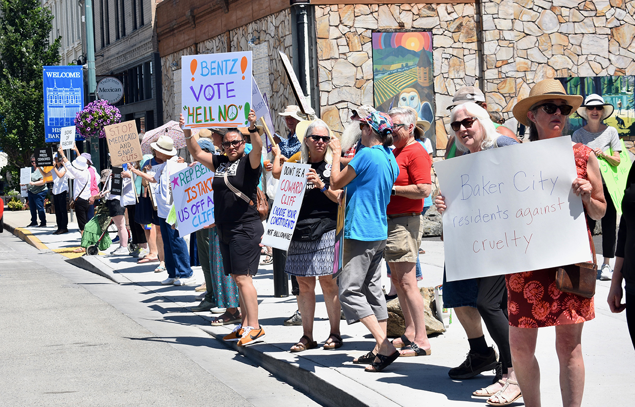 People rally in downtown Baker City to protest proposed cuts to ...